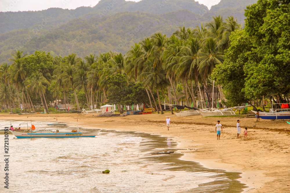 Sabang Beach with palm trees in Puerto Princesa, Philippines Stock ...