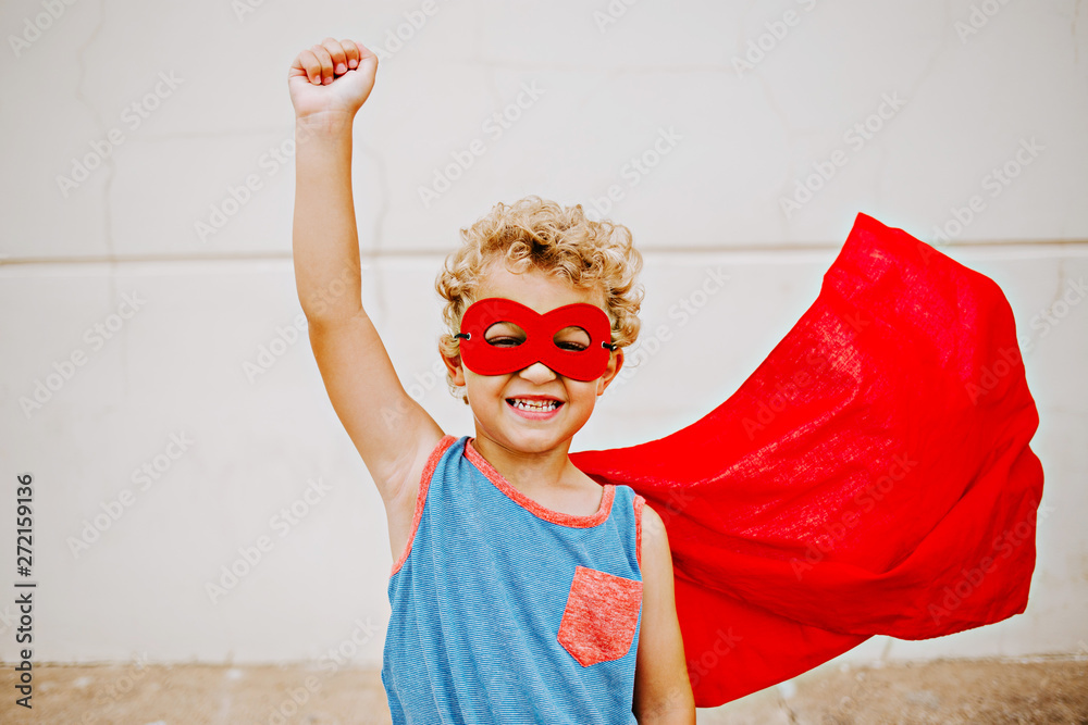 Little boy wearing cape dressed up like a superhero Stock Photo | Adobe ...