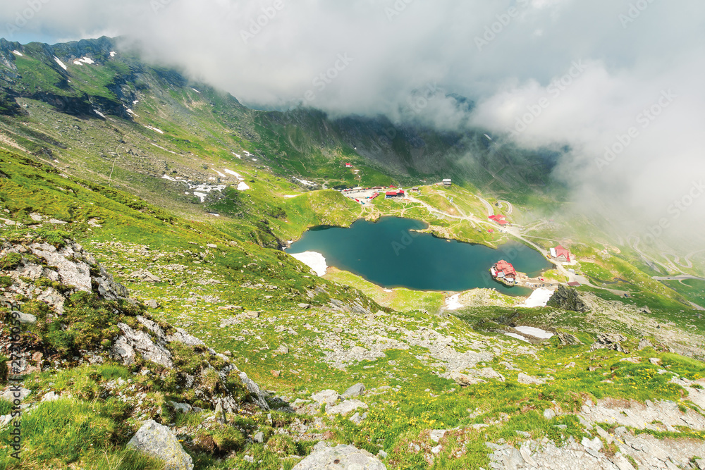 lake balea in dramatic weather. beautiful destination in fagaras ...