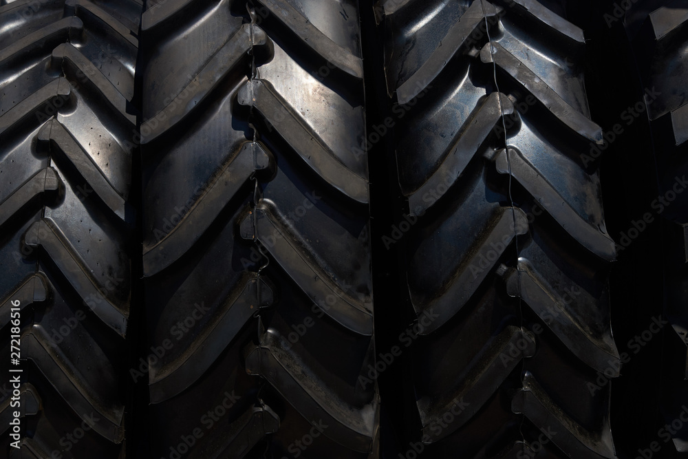 Stack of brand new tractor tires background, close-up Stock Photo ...