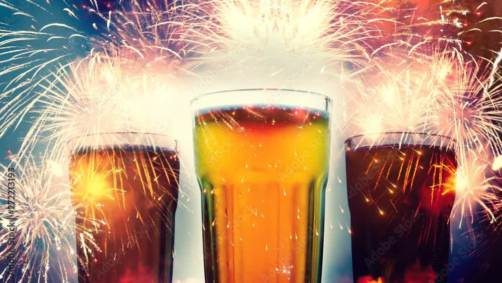 Double exposure of amber beer and fireworks for celebration , festival ...