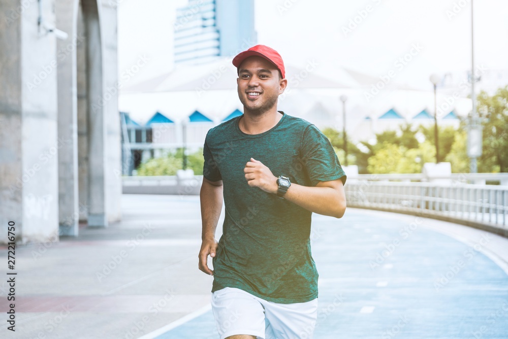 Young asian man running concept Stock Photo | Adobe Stock