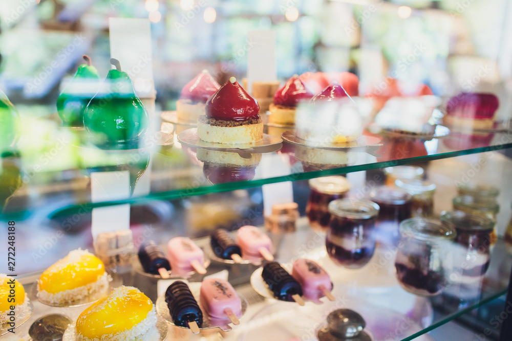 Showcase with sweets chocolate milk Strawberry fruit cakes for sale in ...