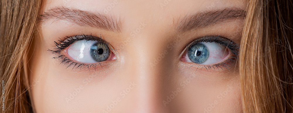 Eyes with squinted look and eyebrows on male face. Female eyes with ...