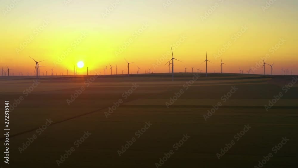 Aerial view of Eolian generators in a beautiful wheat field. Eolian ...