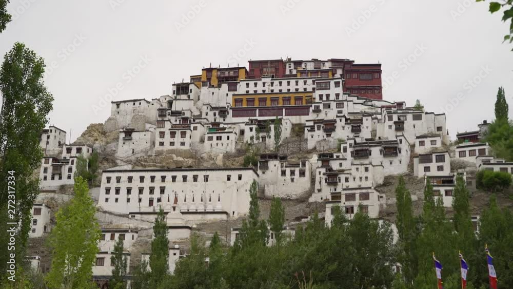 Left dolly reveal shot of the Thiksey, Buddhist monastery east of Leh ...