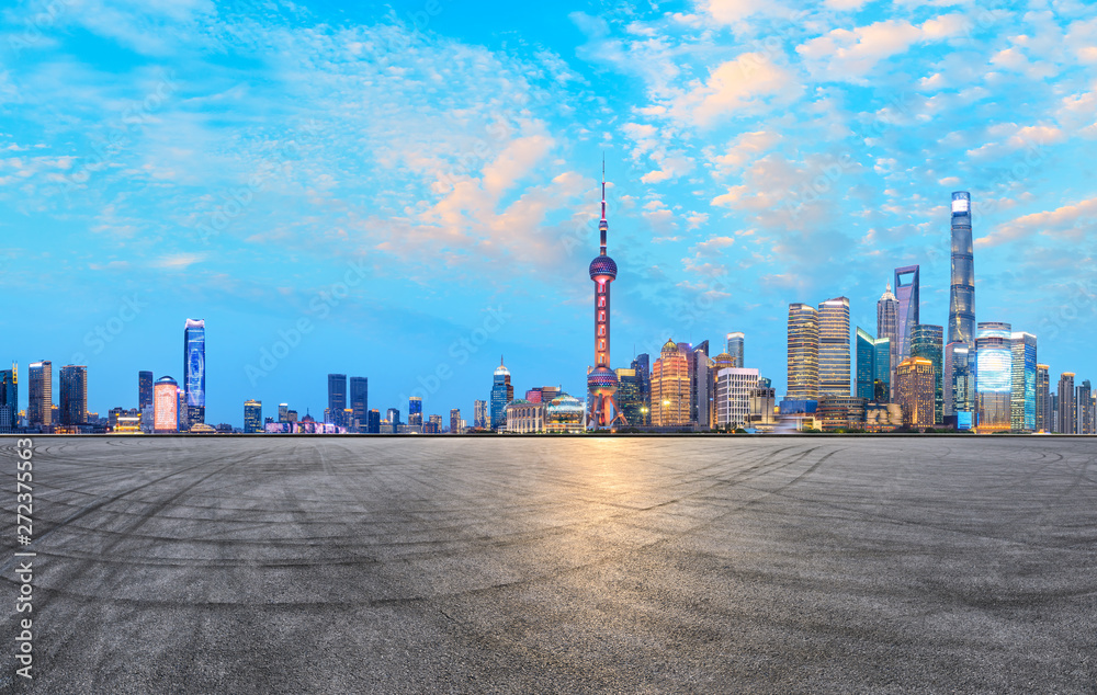 Asphalt race track ground and modern skyline and buildings in Shanghai ...