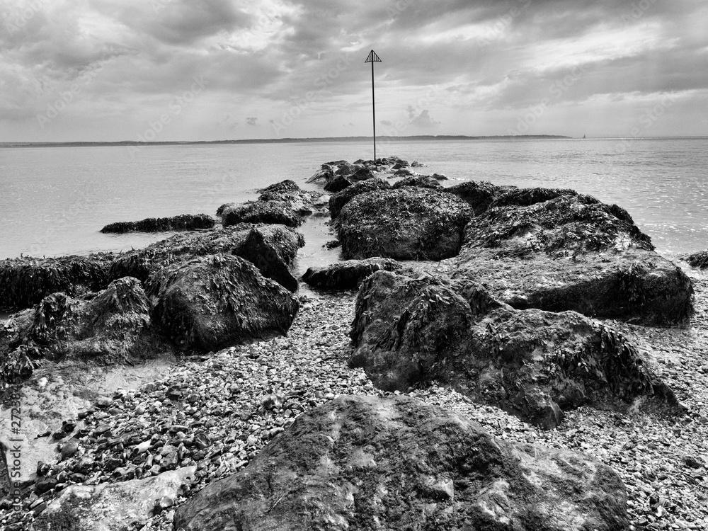 Over the rocks, out in to the River Solent estuary. Processed to ...