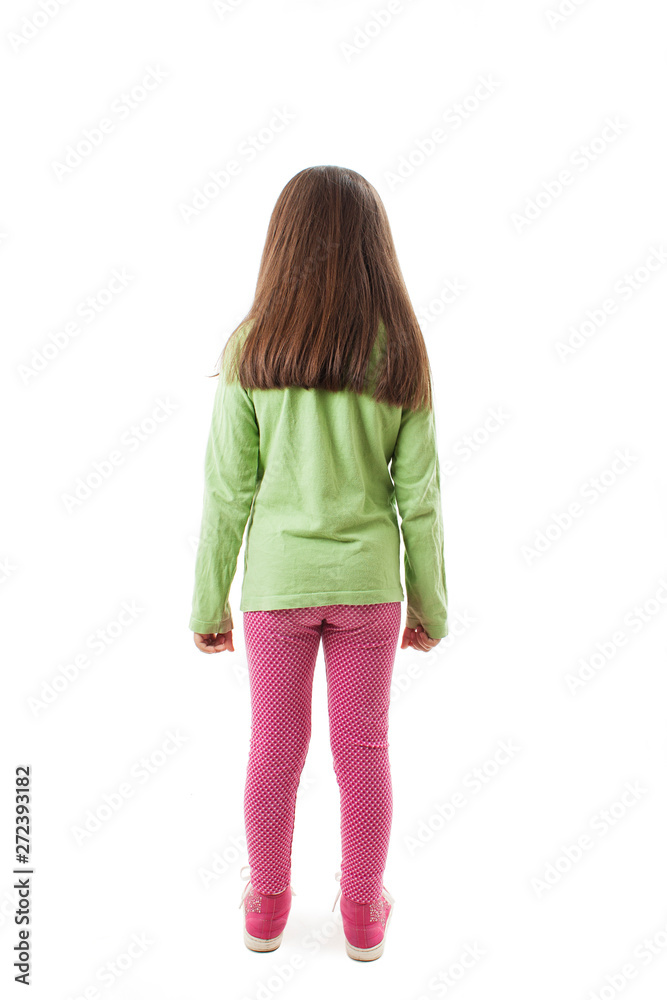 Rear view of modern little girl, standing. Isolated on white background ...
