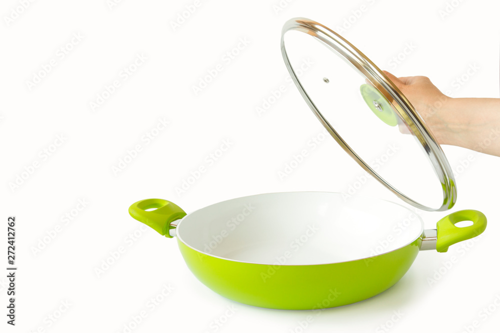 Female hand holding the lid off the pan. Isolated objects on white ...