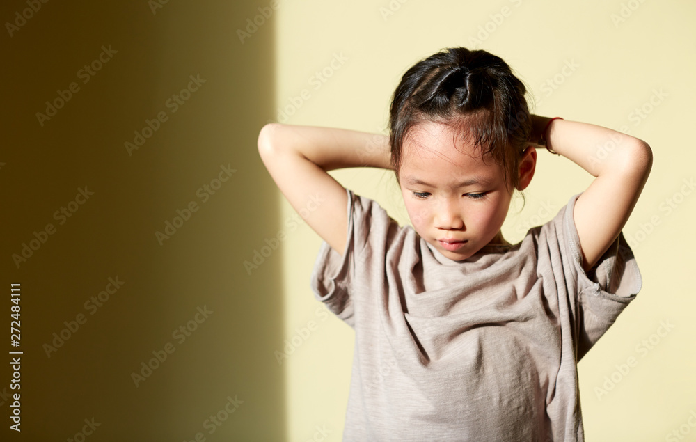 Cute little kid playing with tree shadow on the wall Stock Photo ...