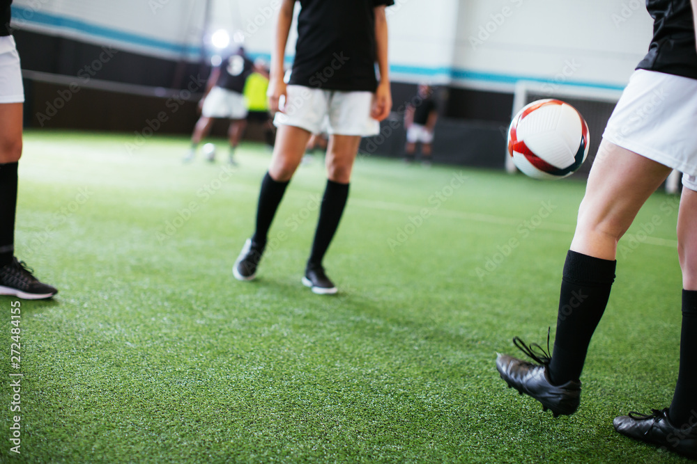 Anonymous soccer players training in football field. Stock Photo ...