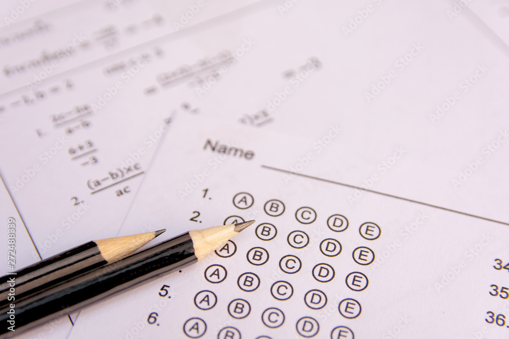 Pencil on answer sheets or Standardized test form with answers bubbled ...