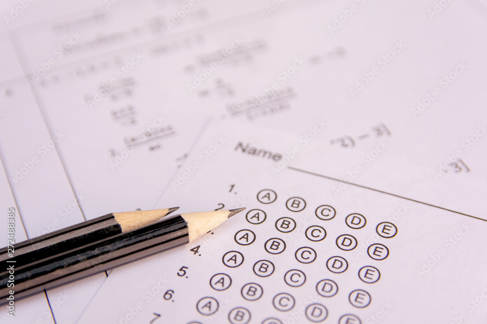 Pencil on answer sheets or Standardized test form with answers bubbled ...