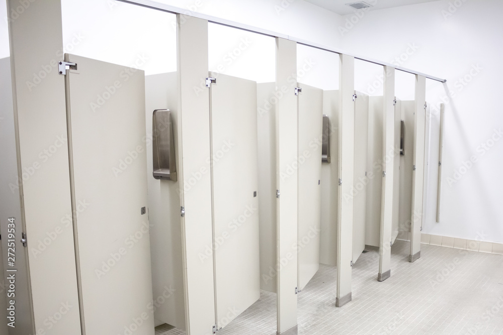Several toilet stalls in a public restroom Stock Photo | Adobe Stock