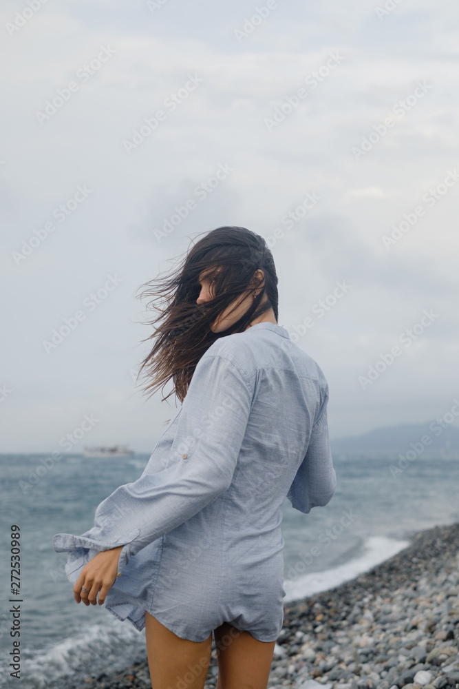 Windy seaside portrait Stock Photo | Adobe Stock