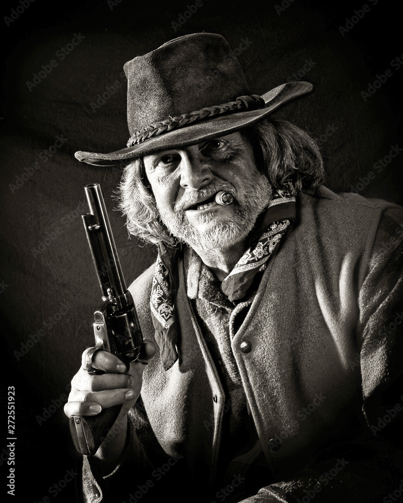 Wild Wild West - Dark Cowboy with Revolver and Cigar Stock Photo ...