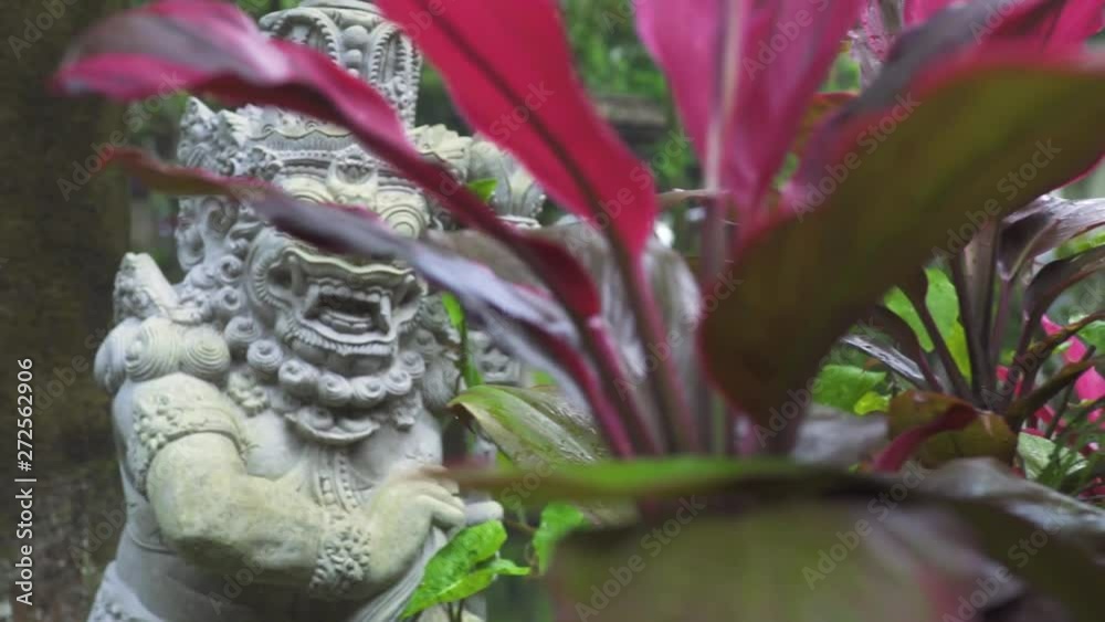 Indonesia god statue on tropical plant background in Bali temple ...