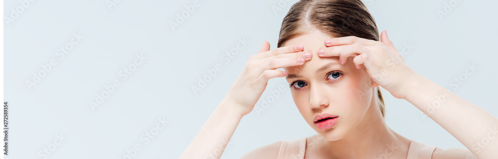 displeased teenage girl touching pimple on face, panoramic shot Stock ...