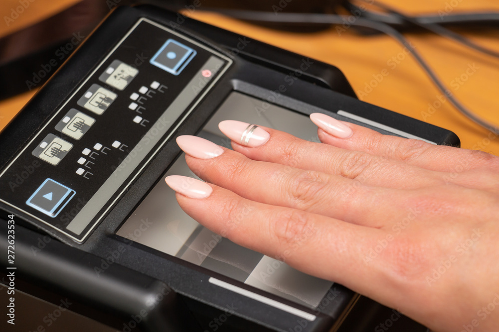 Foto de The process of scanning fingerprints during the check at border ...
