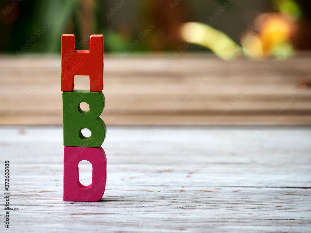 Wood letter in word HBD (Abbreviation of happy birthday) on wood table ...