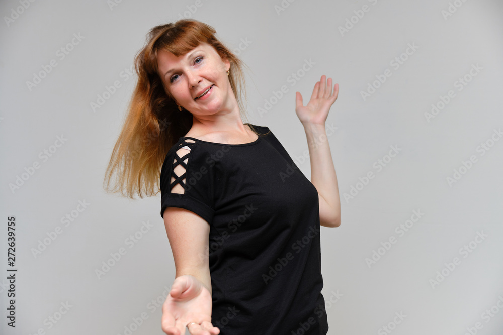 Studio portrait of a beautiful pretty woman aged 40 years on a white ...