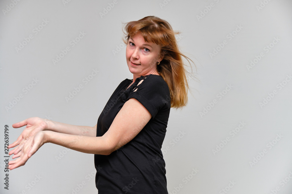 Studio portrait of a beautiful pretty woman aged 40 years on a white ...