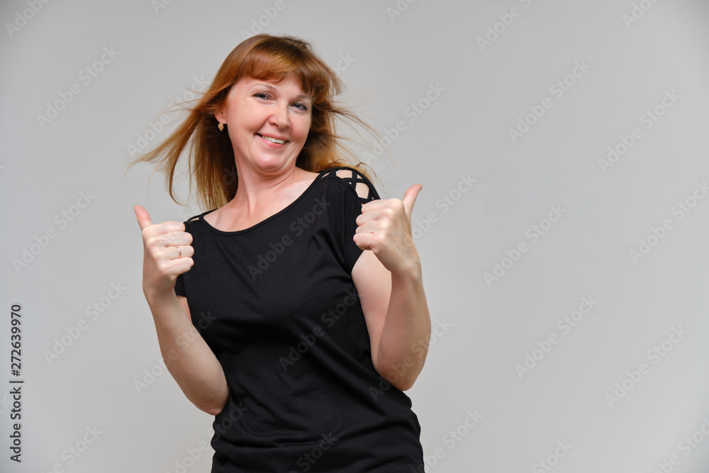 Studio portrait of a beautiful pretty woman aged 40 years on a white ...
