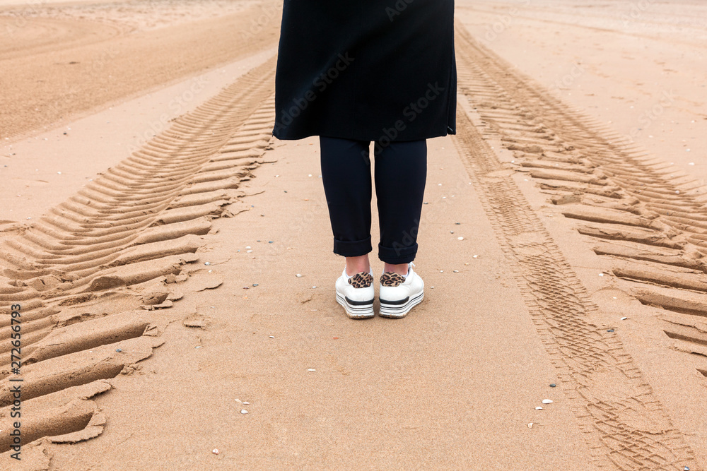 girl sand sea woman wind rain way road walk stap North Scheveningen The ...