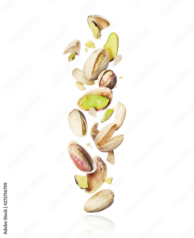 Cracked pistachios fall down on white background Stock Photo | Adobe Stock