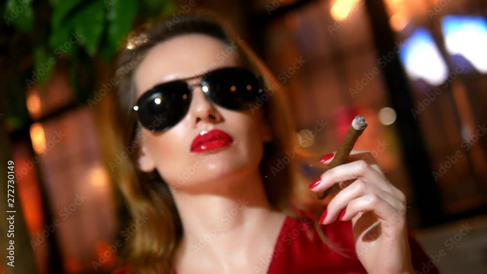 gorgeous woman in red dress with red lipstick on her lips and dark ...