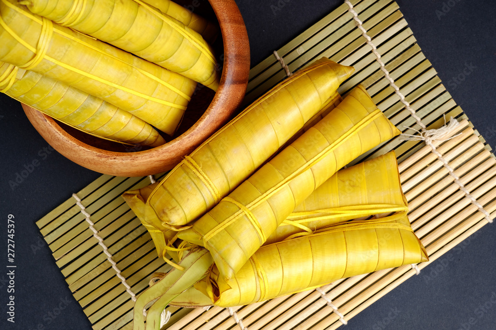 Suman sa Ibos, a traditional sticky rice cake wrapped in buli leaves ...