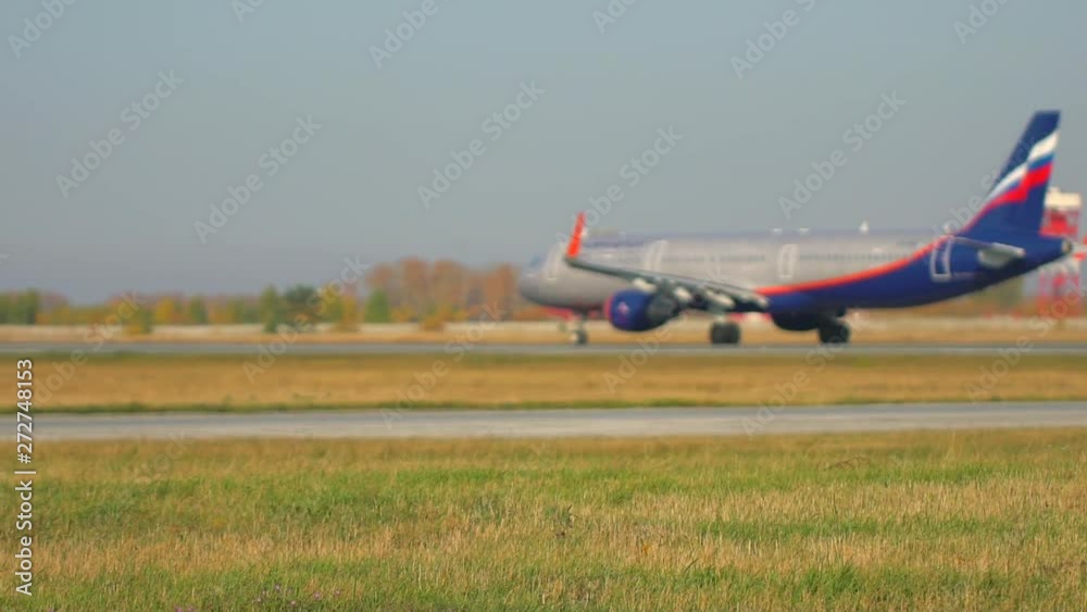 Commercial airplane aircraft moving and driving along runway at ...