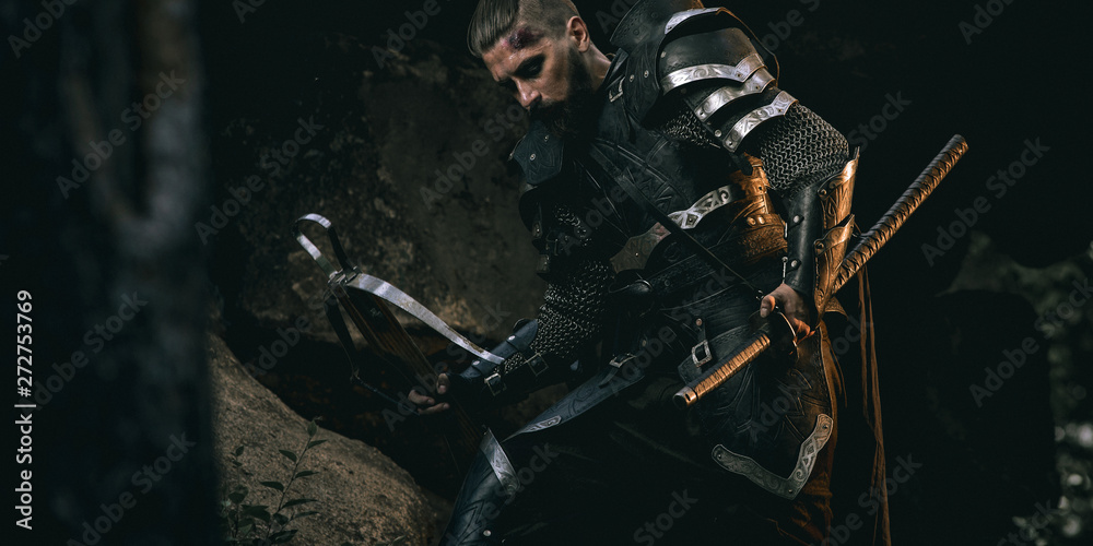 Knight with sword and crossbow Stock Photo | Adobe Stock