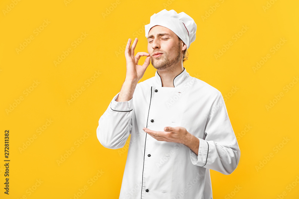 Handsome male chef on color background Stock Photo | Adobe Stock