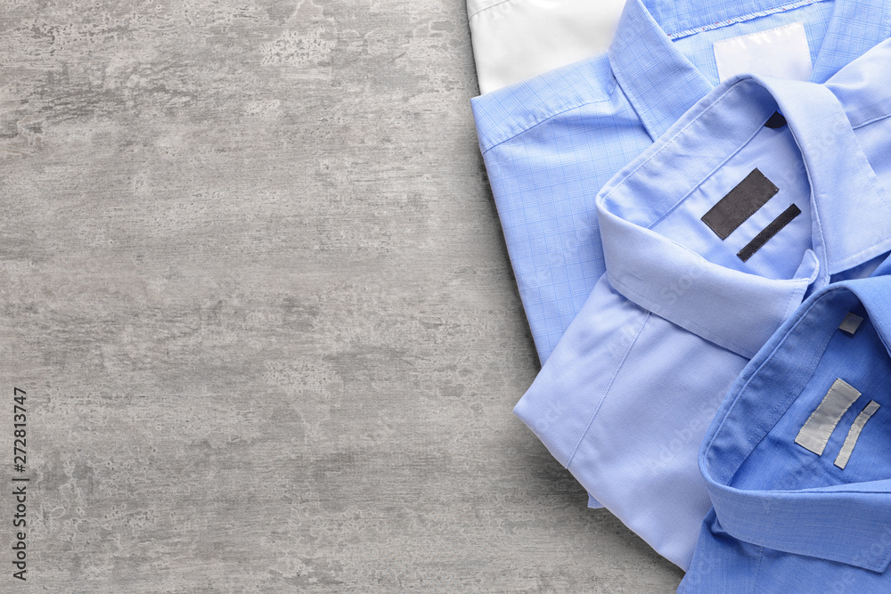 Shirts after dry-cleaning on wooden background Stock Photo | Adobe Stock