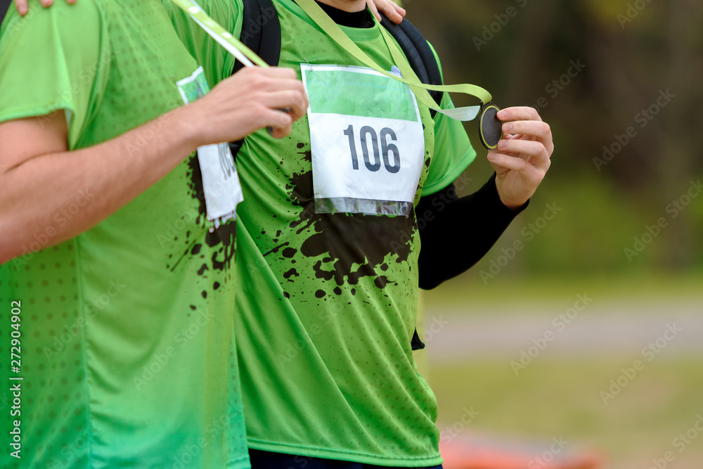 Two marathon runners take pictures with their medals Stock 写真 | Adobe Stock