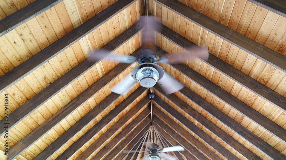 wooden roof with interior ceiling fan Stock Photo | Adobe Stock
