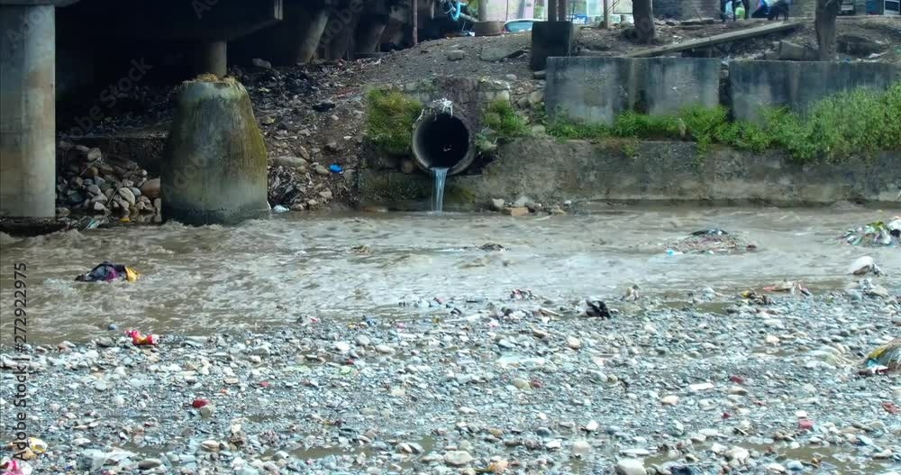 A polluted small river.water pollution, river pollution, dirty water ...