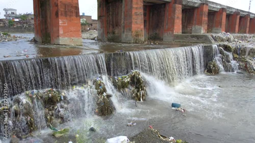 Time lapse of a polluted small river.water pollution, river pollution ...