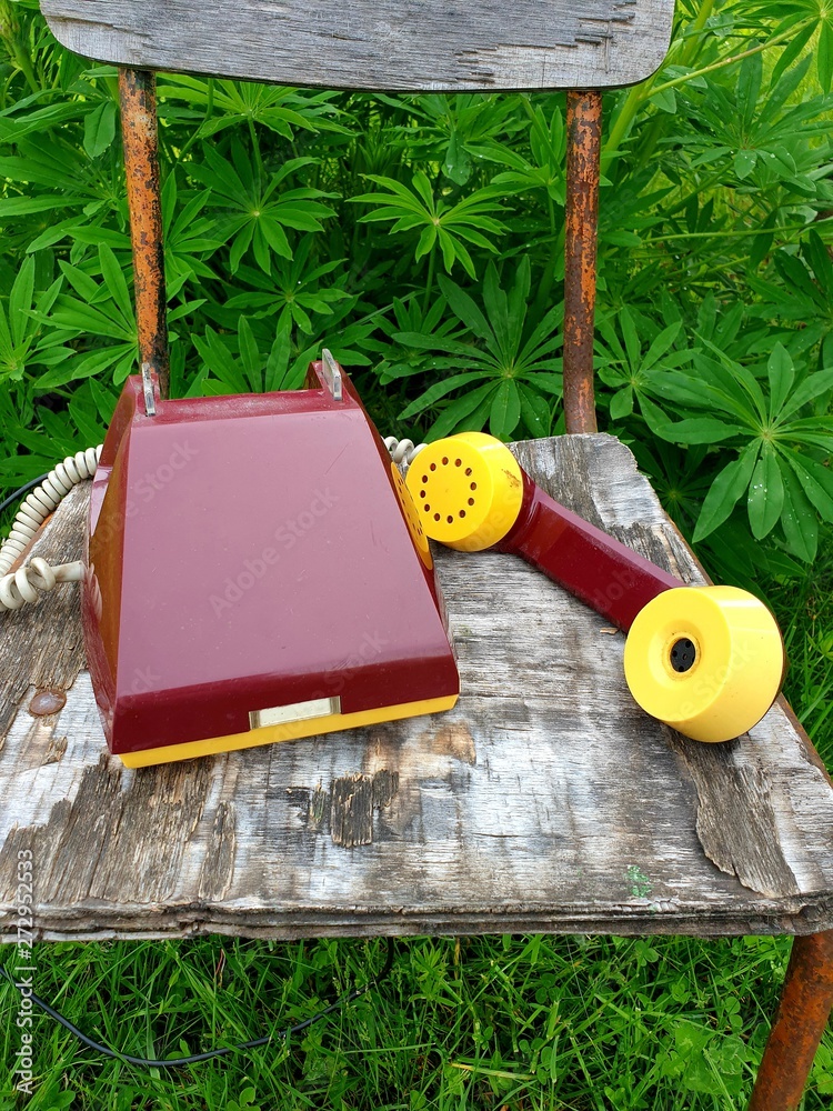 old telephone with speaking tube on the wire, old telephone in nature ...