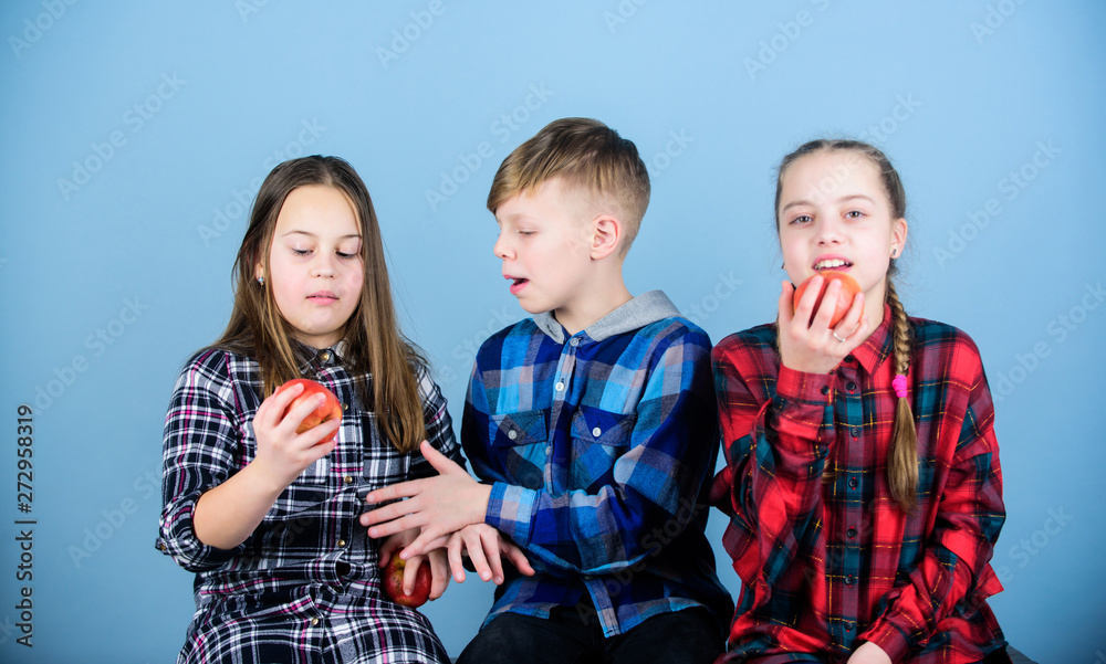 Boy and girls friends eat apple. Teens with healthy snack. Group ...