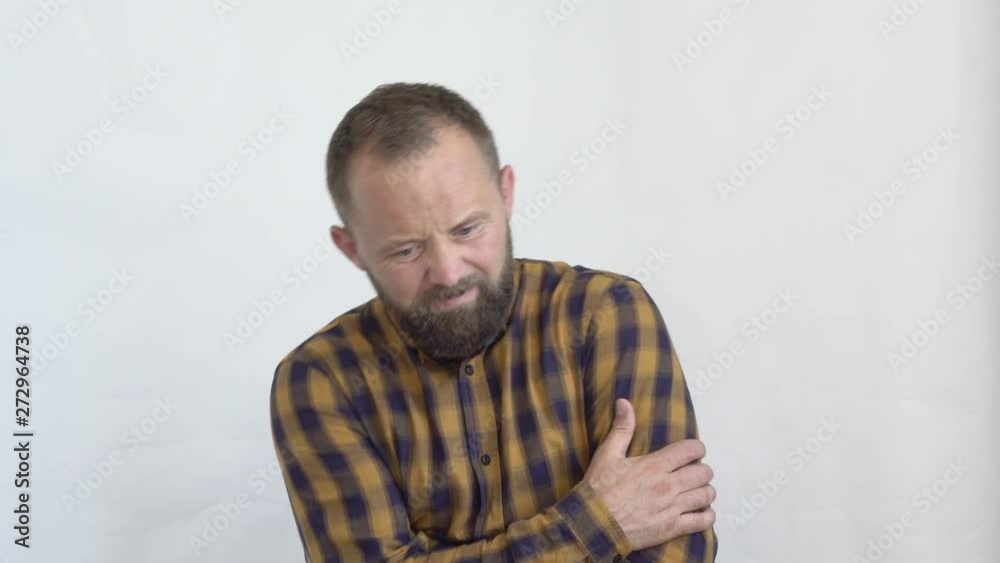 concept of emotions close-up of a bearded man in a plaid shirt on a ...