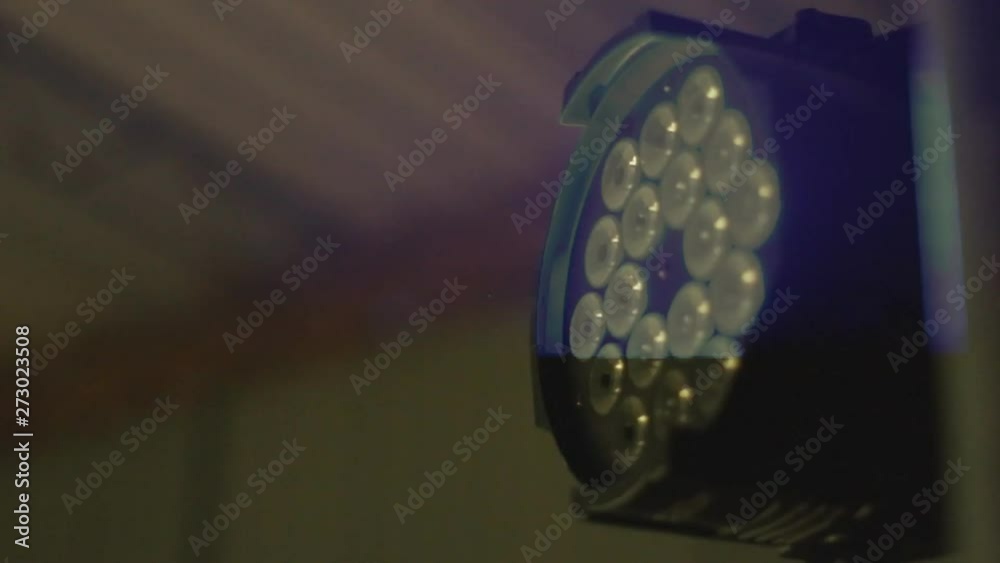Nightclub LED spotlights glowing with different colored lights, moving ...