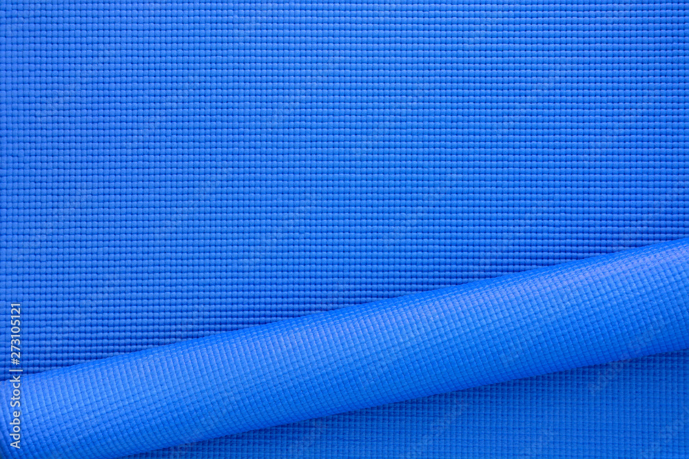 close up roll blue color yoga mat texture background,top view, copy ...