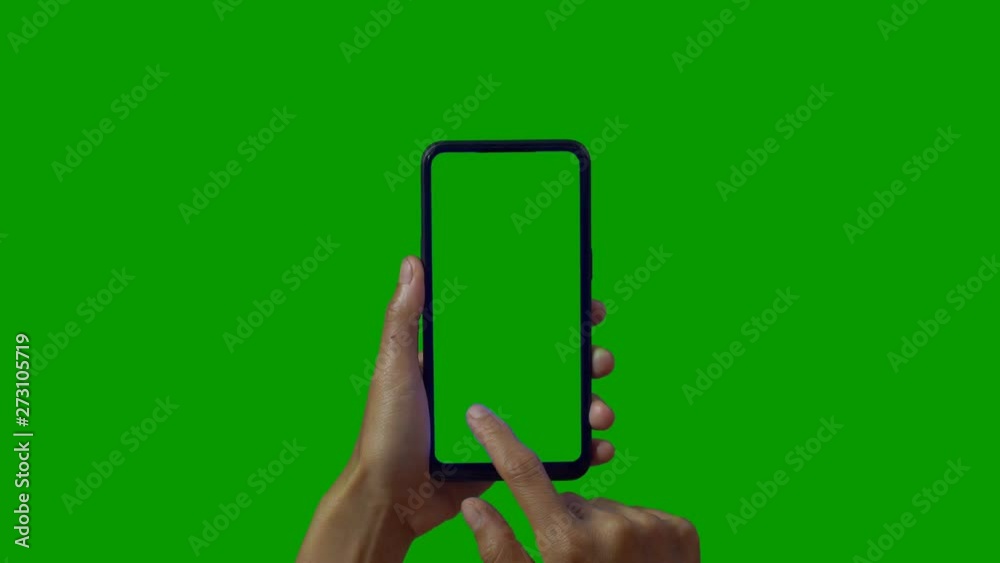 Phone in the hand close up isolated at green background. Phone screen ...