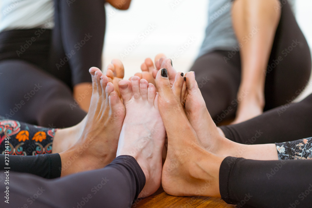 Team together placing feet in for teamwork Stock Photo | Adobe Stock