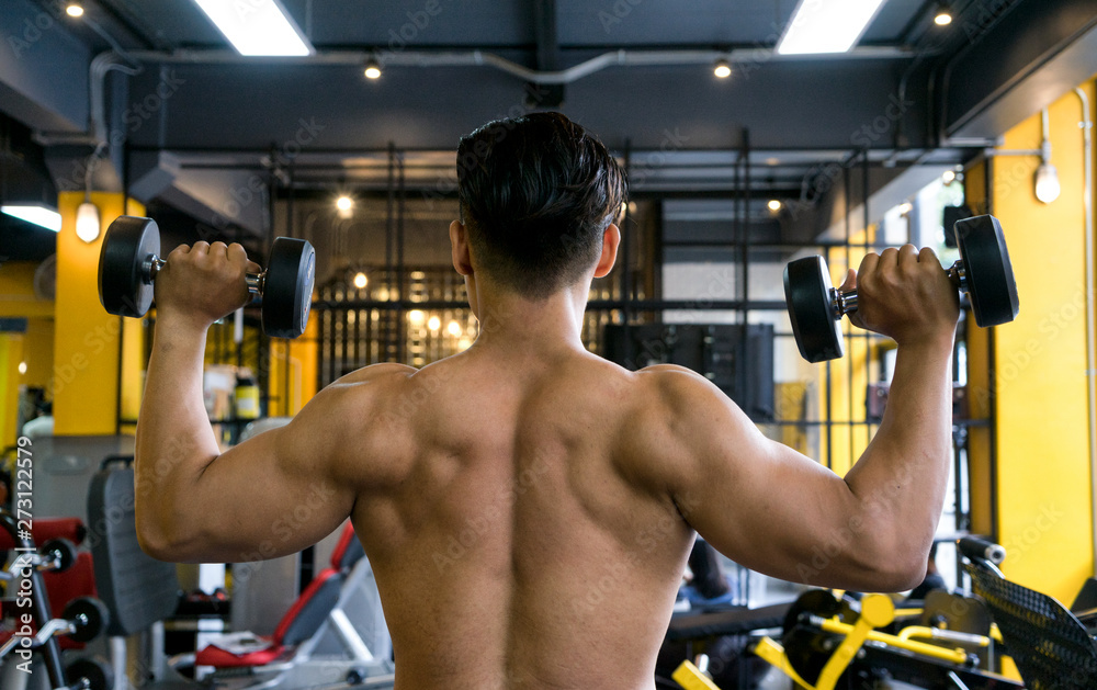 Strong well built bodybuilder asian for lifting dumbbell weights ...