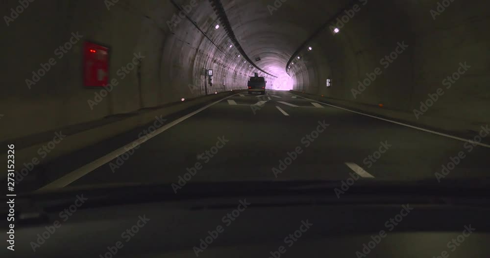 View through front window of car of the exit of a long Japanese ...