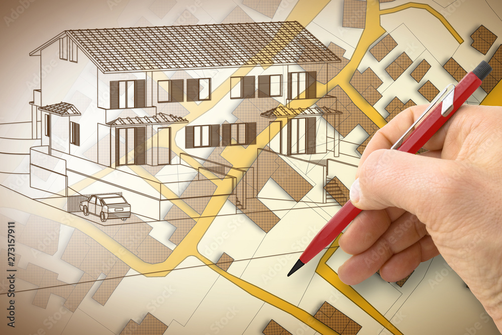 Architect drawing a duplex residential building over an imaginary ...